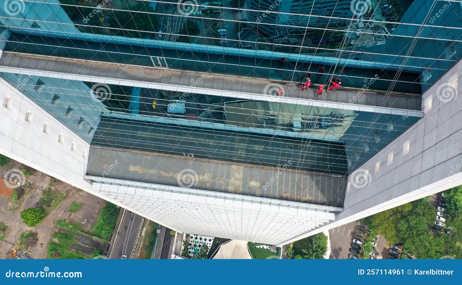 Aerial Top Down View of Window Cleaners Working on a Glass Facade ...