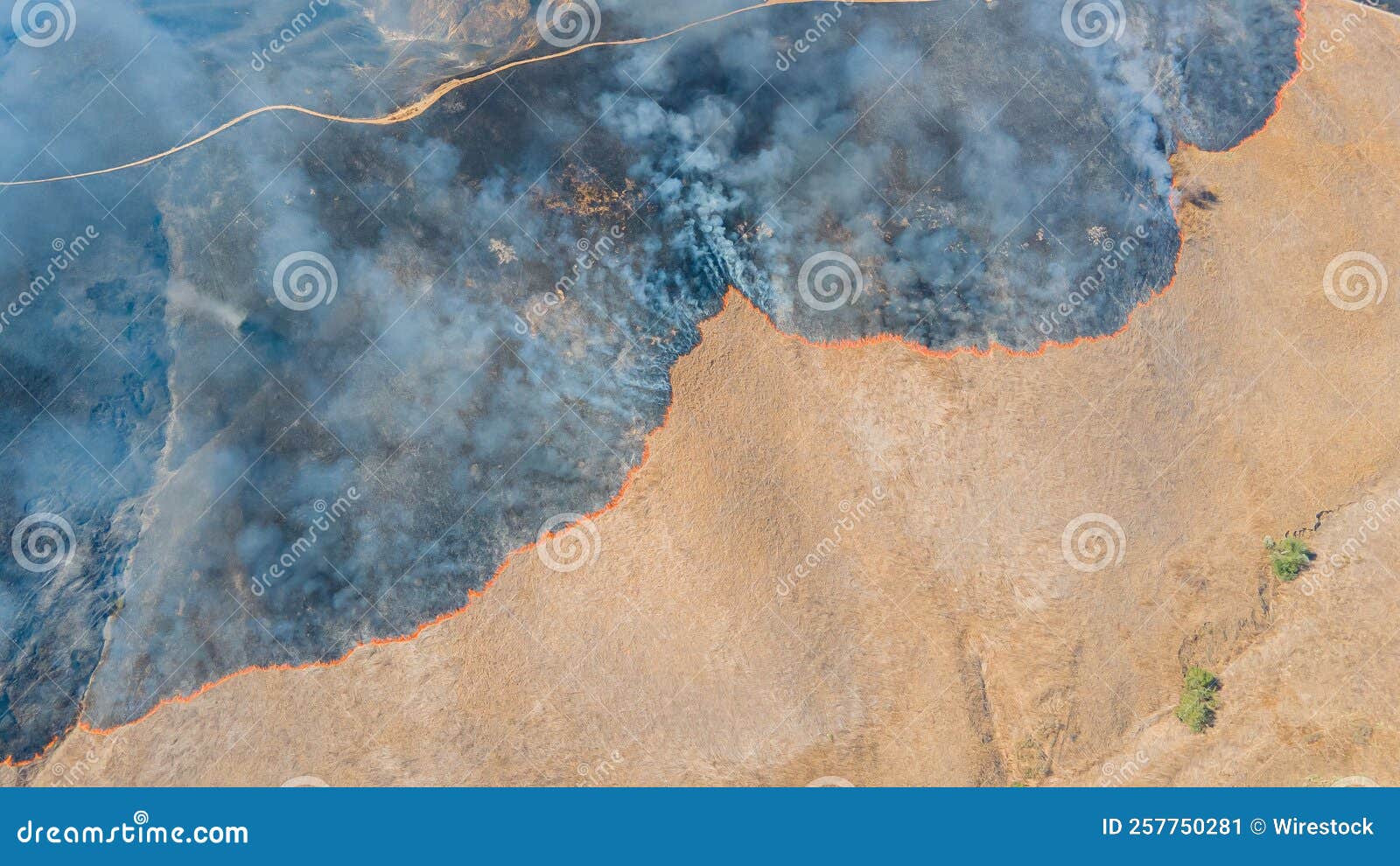 Aerial Top Shot Burning Black Vegetation Approaching the Sand Stock ...