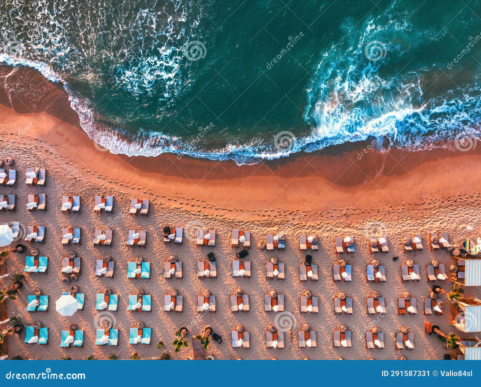 Aerial Top View on the Beach. Umbrellas, Sand and Sea Waves during ...