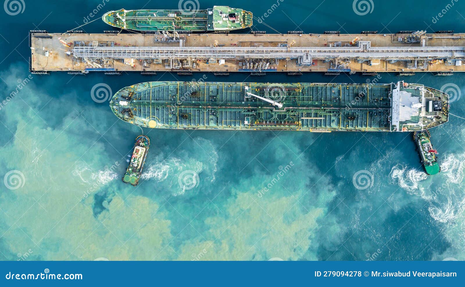 Aerial Top View Oil Tanker Ship At Terminal Industrial Port Tugboat ... Aerial Top View Oil Tanker Ship At Terminal Industrial Port Tugboat ...