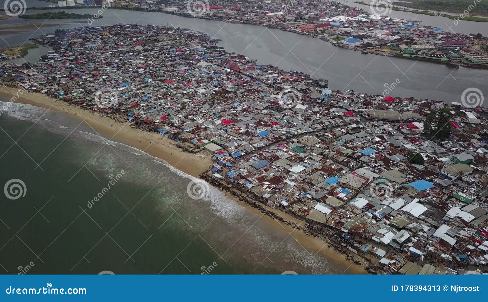 Aerial Tracking Above Massive Slum on Beach Stock Video - Video of ...