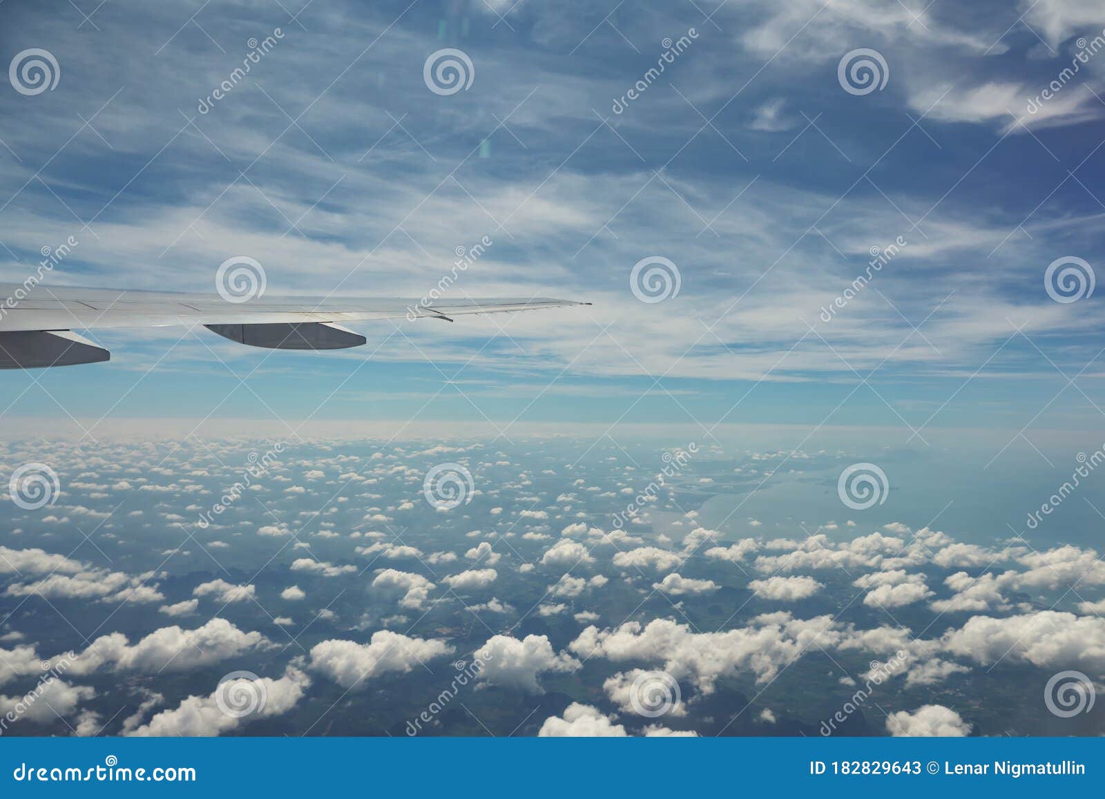 Flying Over the Layer of Clouds and Looking on Landscape through the ...