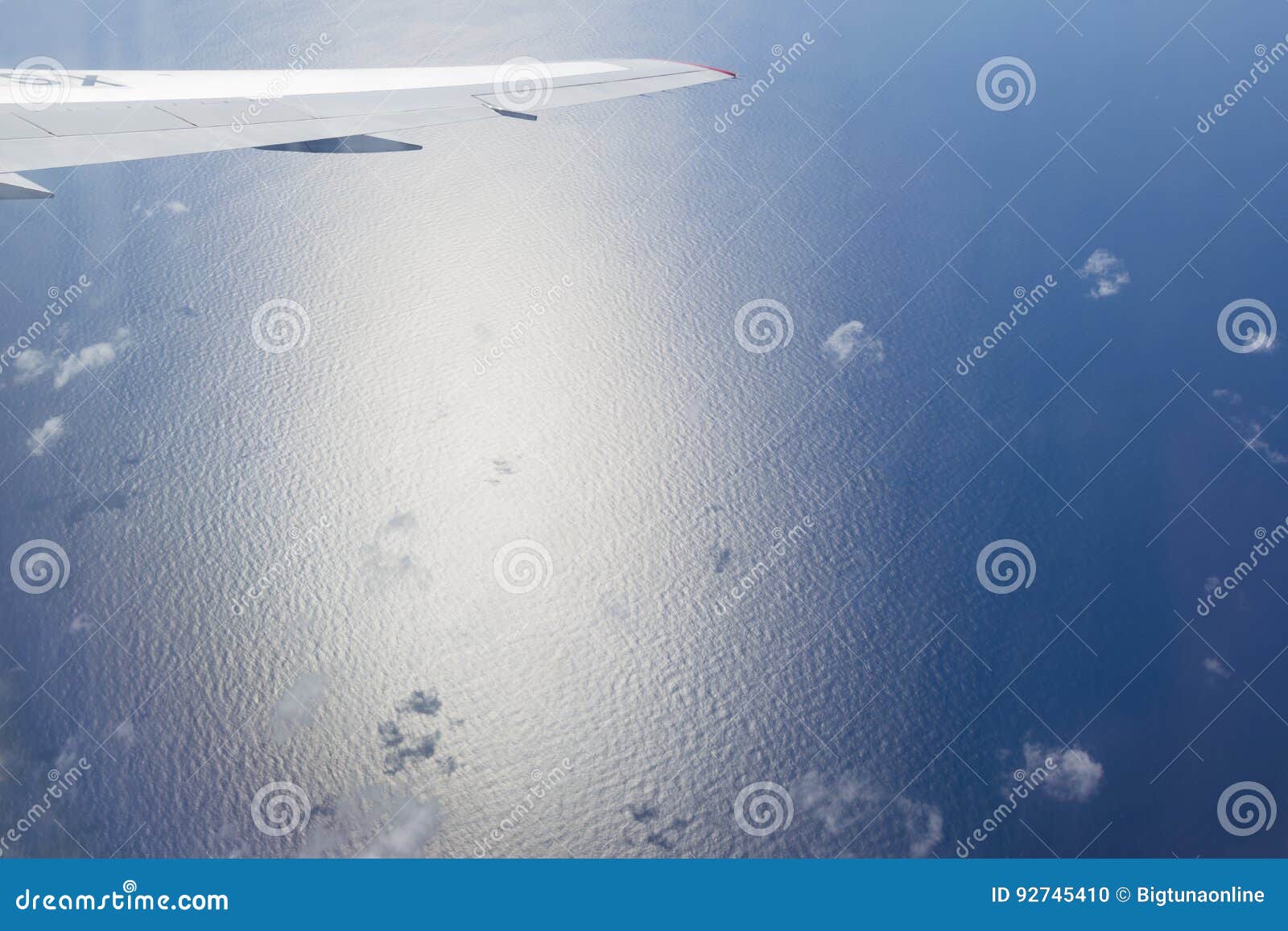 Aerial View of Airplane Wing Over Blue Tropical Ocean Stock Photo ...
