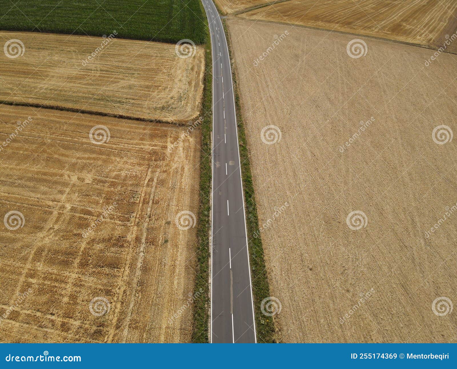 Aerial View of a Asphalt Road between Mowed Grainfields in Summer Stock ...