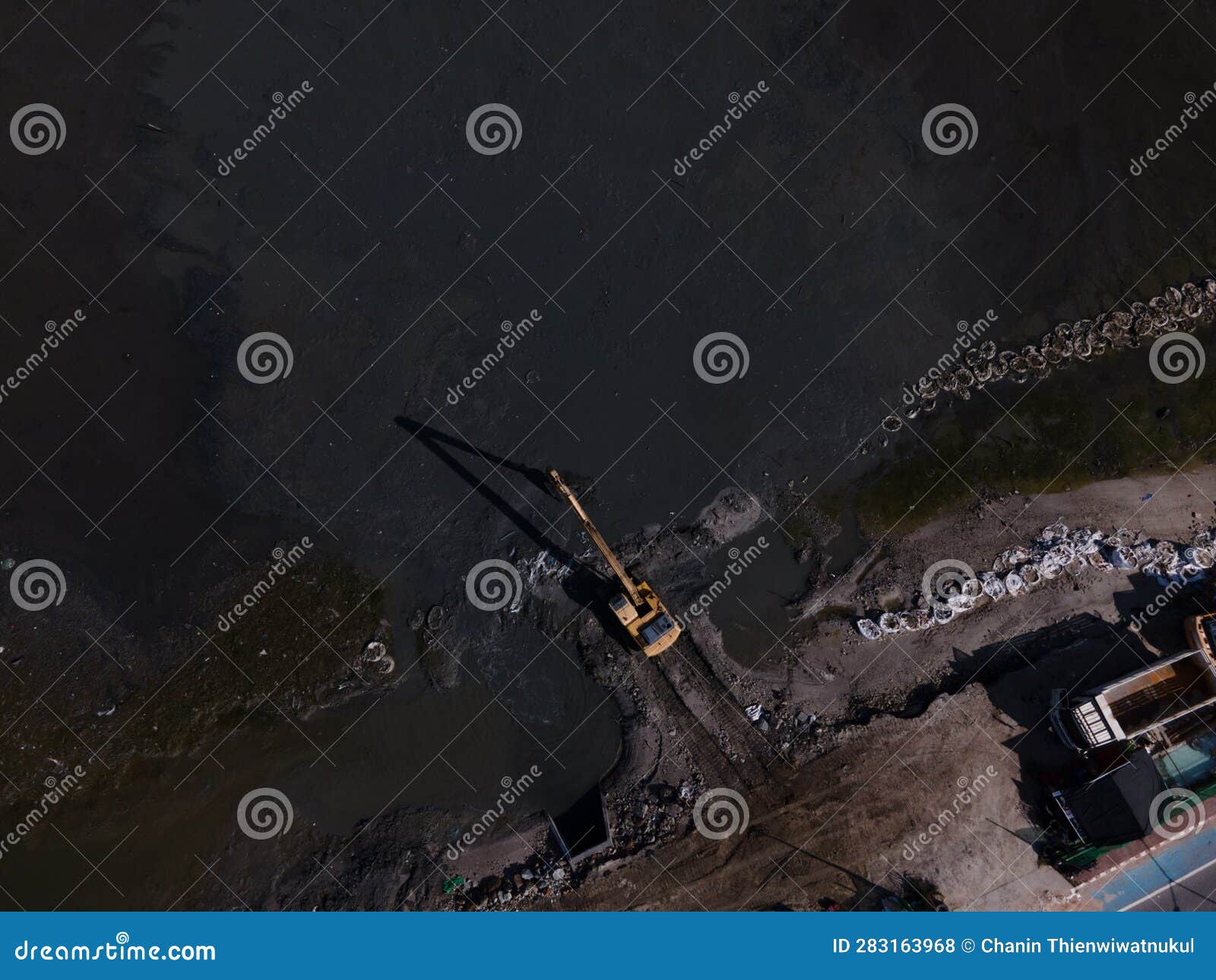 Aerial View of Backhoe Working on the Mud for Solve Pollution Problems ...