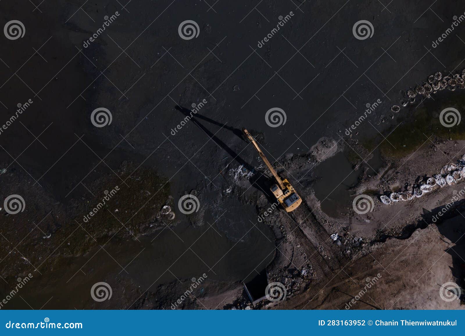 Aerial View of Backhoe Working on the Mud for Solve Pollution Problems ...