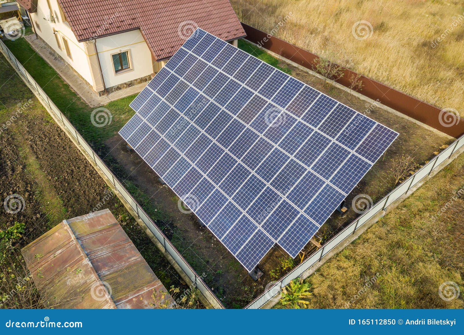Aerial View of Big Blue Solar Panel Installed on Ground Structure Near ...