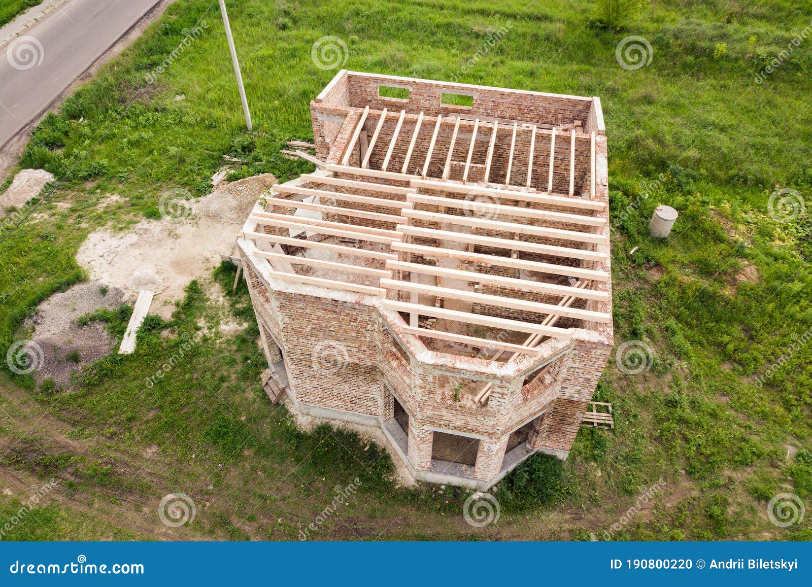Aerial View of a Brick House with Wooden Ceiling Frame Under ...