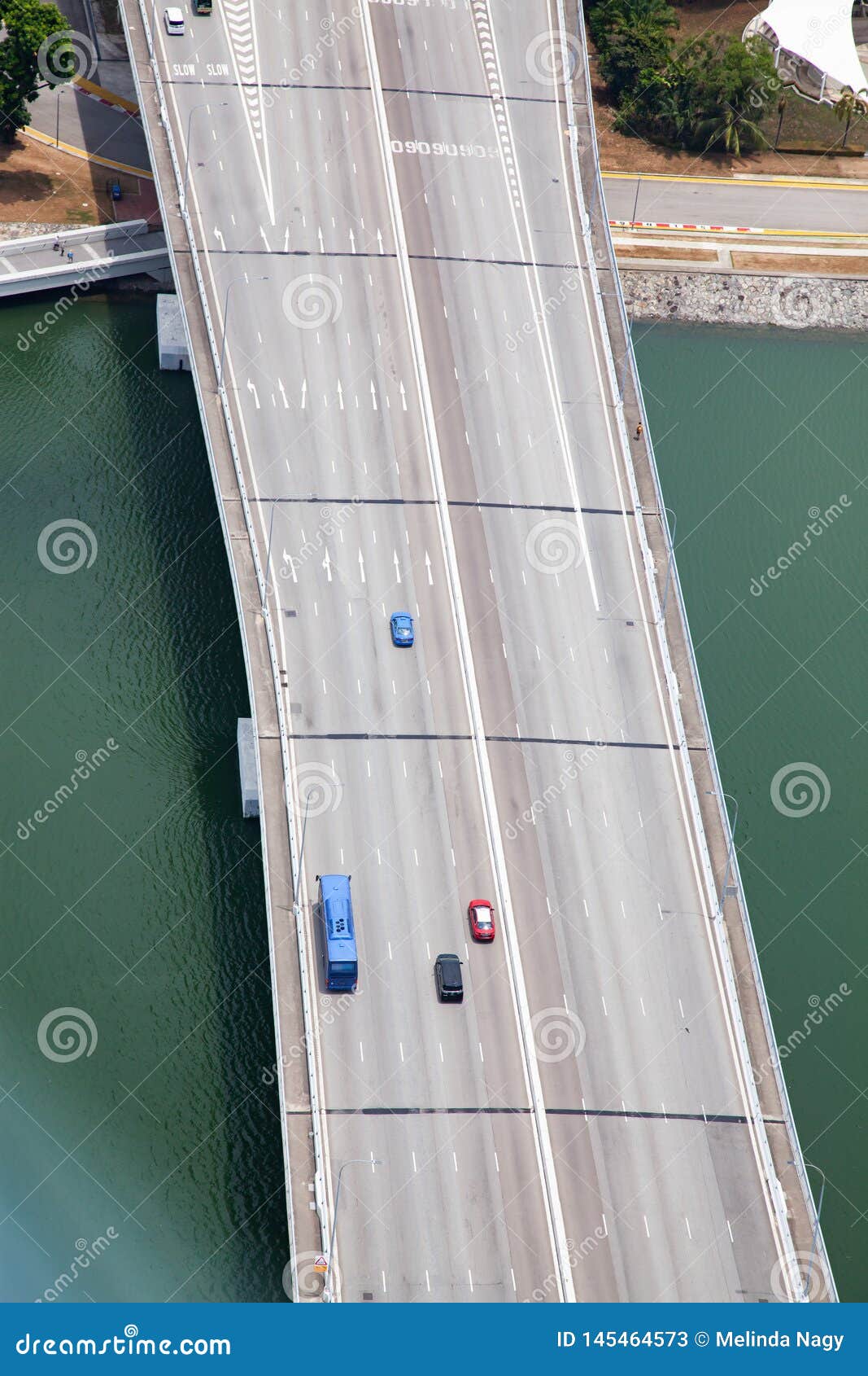 Aerial View of a Bridge and Traffic and Green Water Surface Stock Image ...