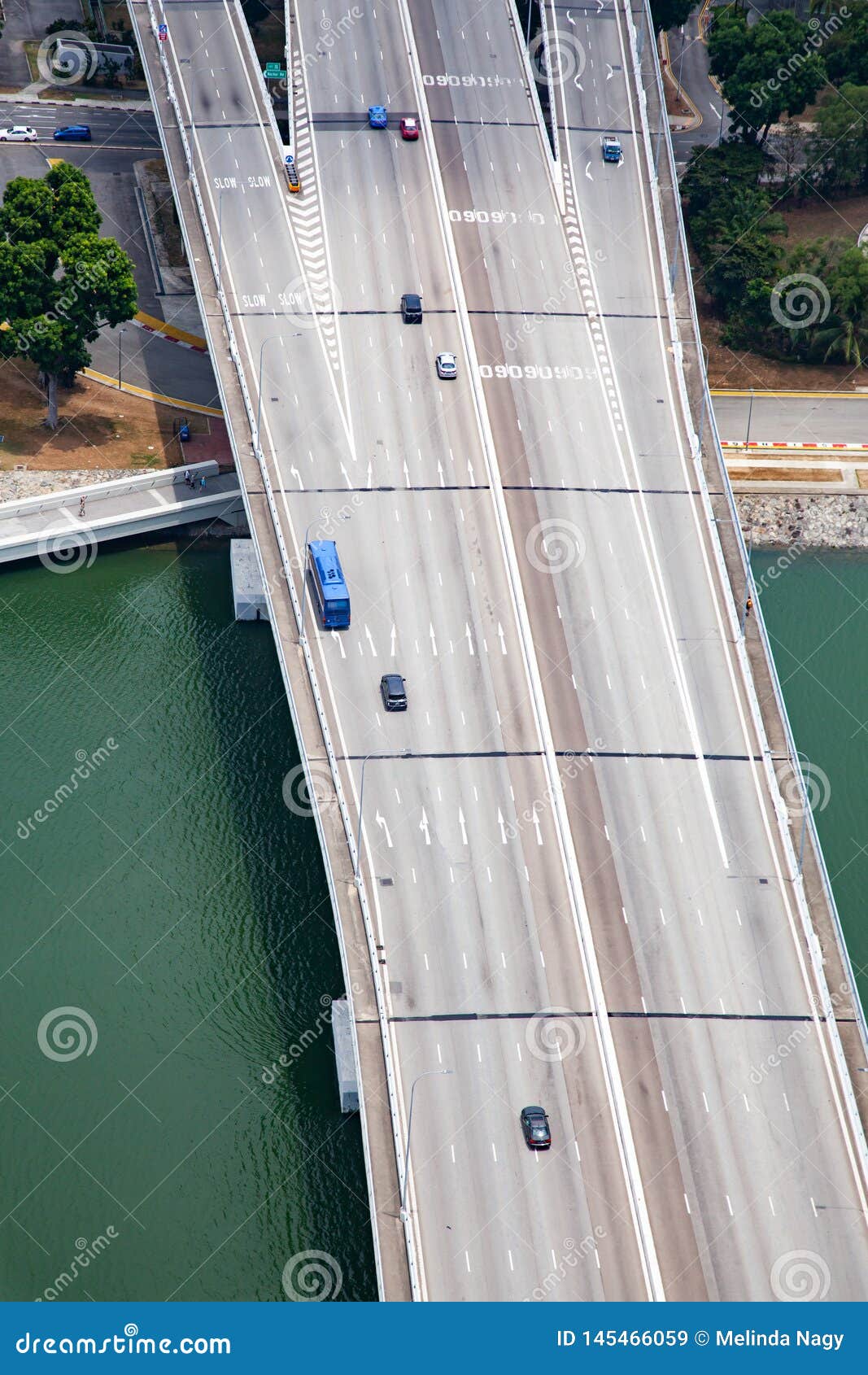 Aerial View of a Bridge and Traffic and Green Water Surface Stock Image ...