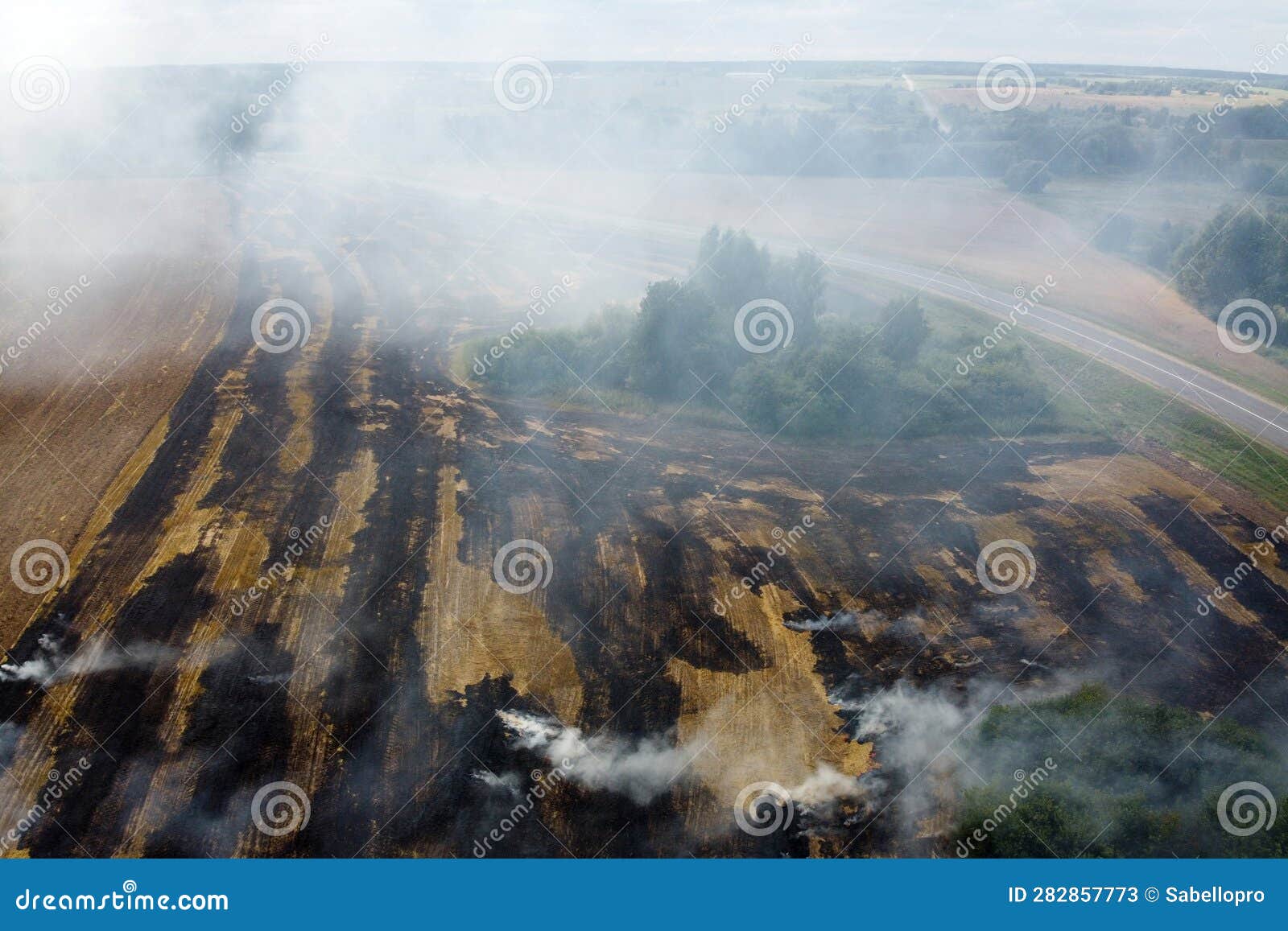 Aerial View of Burning Field with Smoke and Road Stock Image - Image of ...
