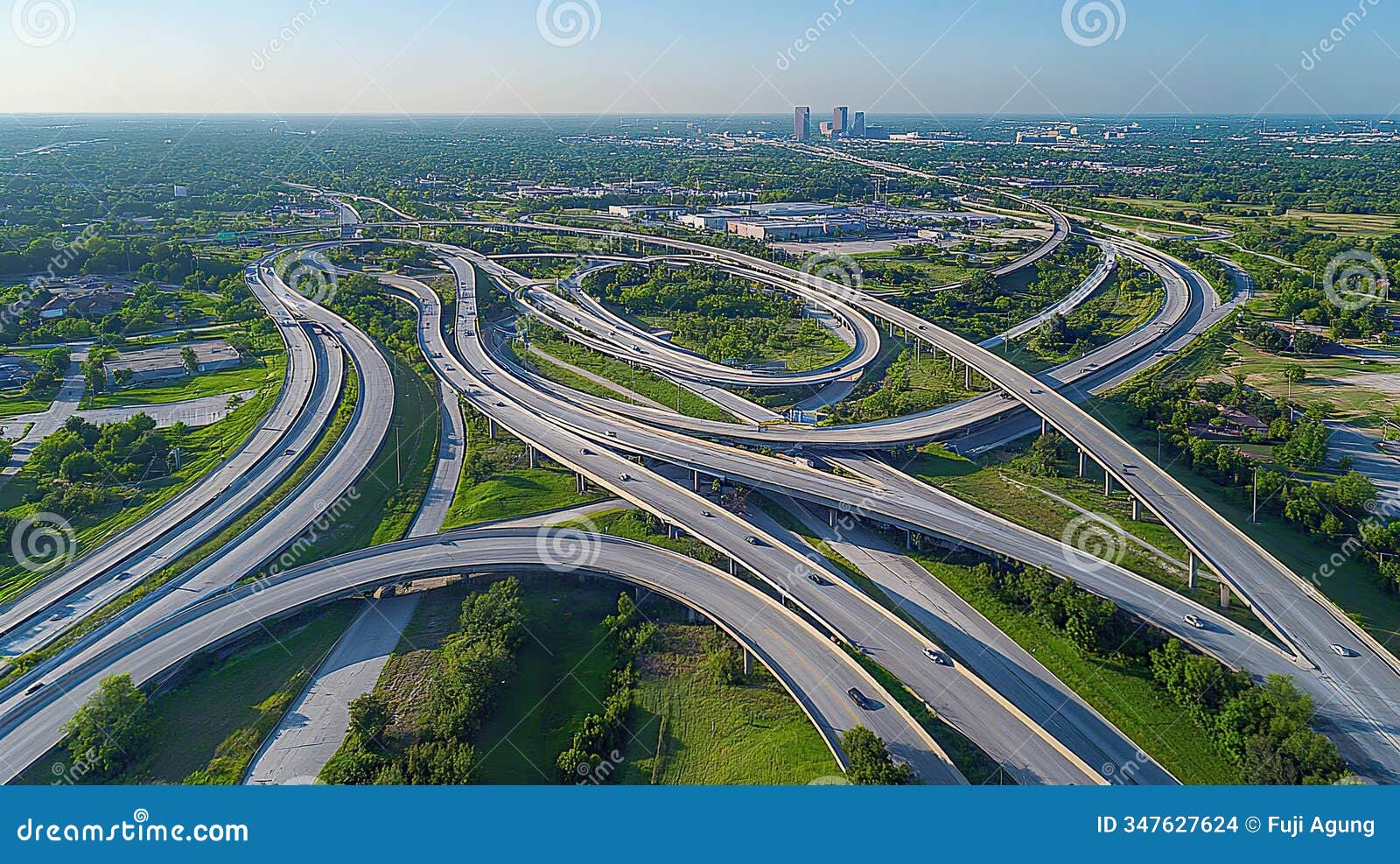 Aerial View of a Complex Highway Interchange with City Skyline in the ...