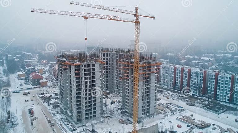 Aerial View of a Construction Site with Cranes and Building Under Construction Stock ...