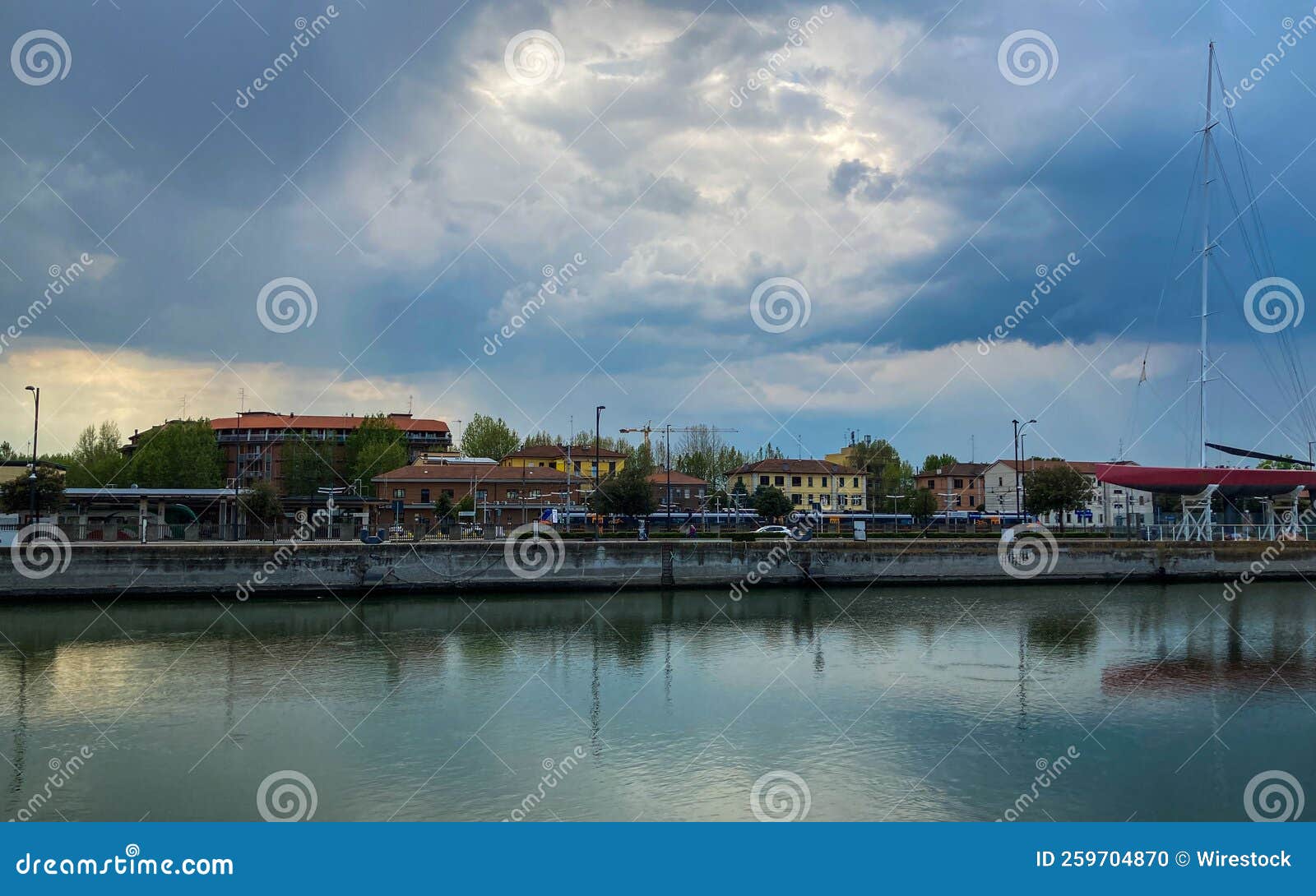 Aerial View of Dock Surrounded by Buildings with Reflection in Water in ...