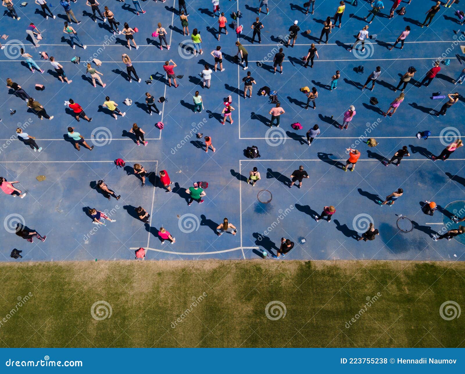 Aerial View from a Drone of a Group of People Doing Physical Exercise ...