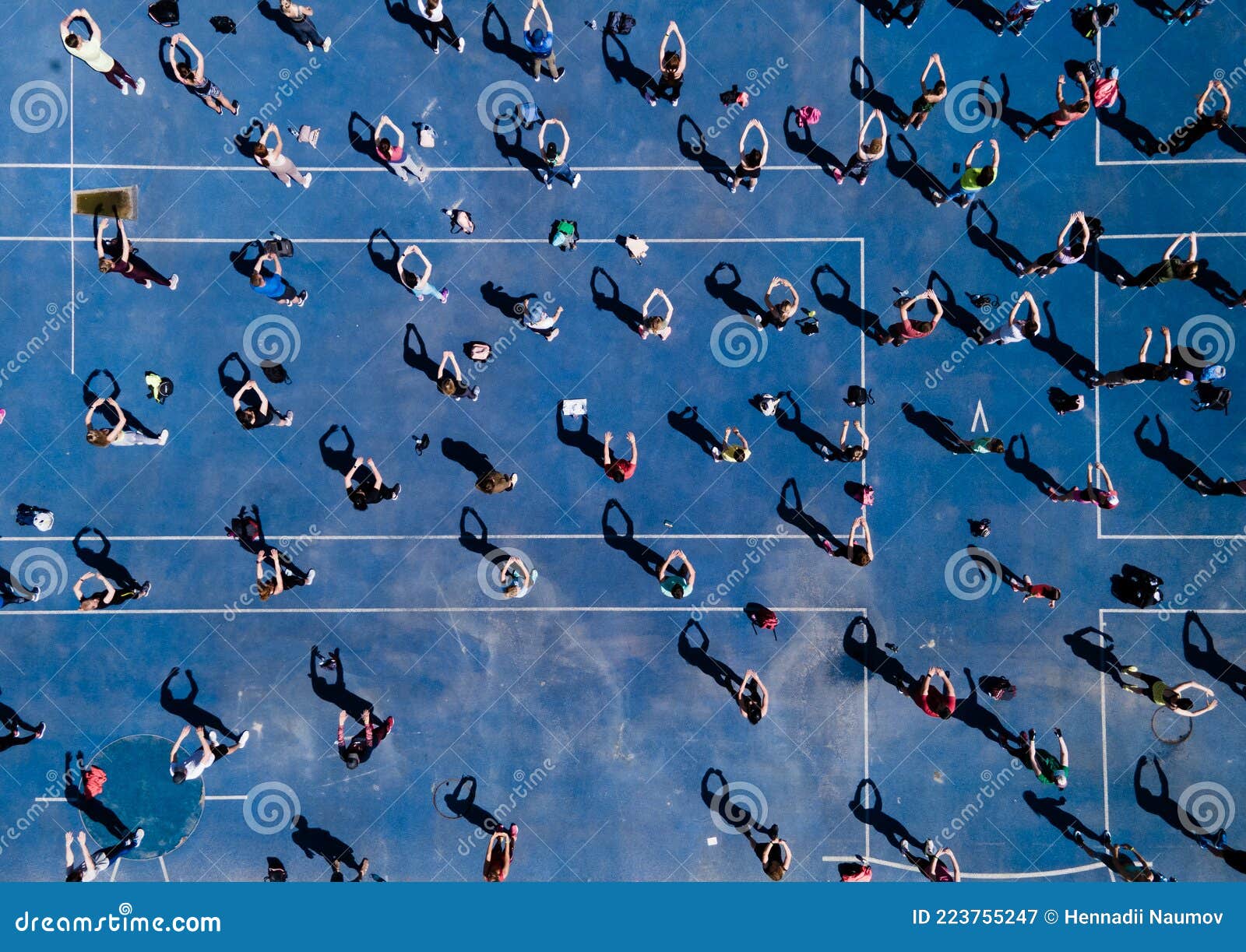 Aerial View from a Drone of a Group of People Doing Physical Exercise ...