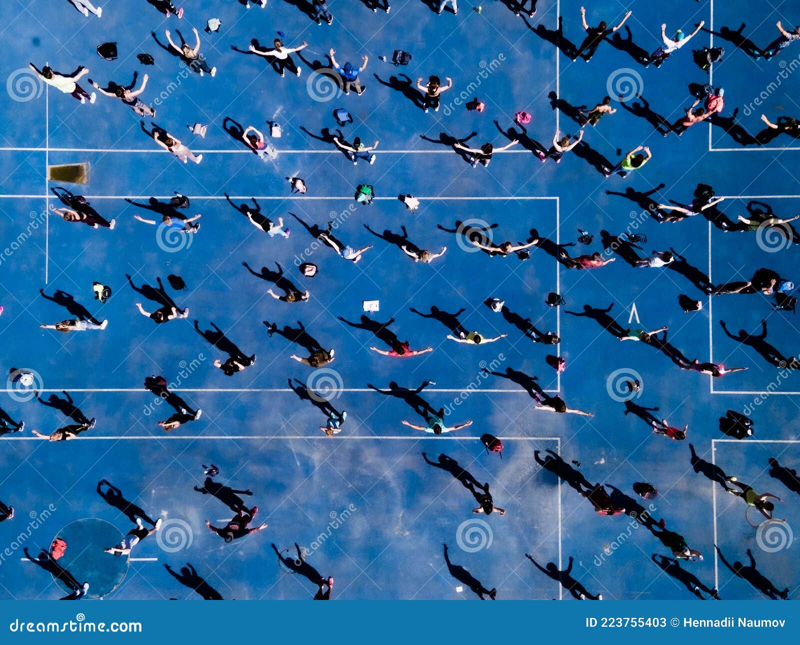 Aerial View from a Drone of a Group of People Doing Physical Exercise ...