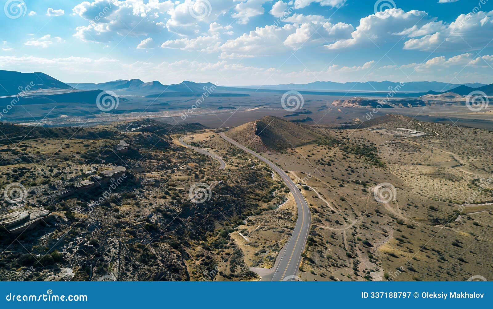 Aerial View of an Empty Road Passing through Remote Desert Landscape ...