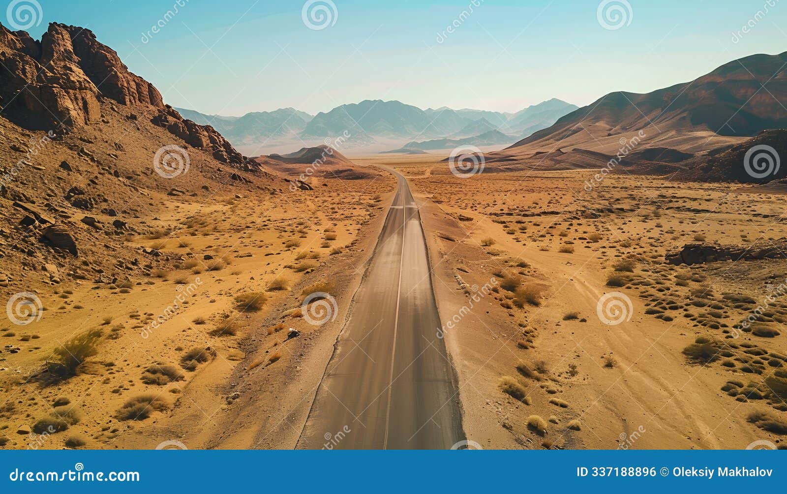 Aerial View of an Empty Road Passing through Remote Desert Landscape ...