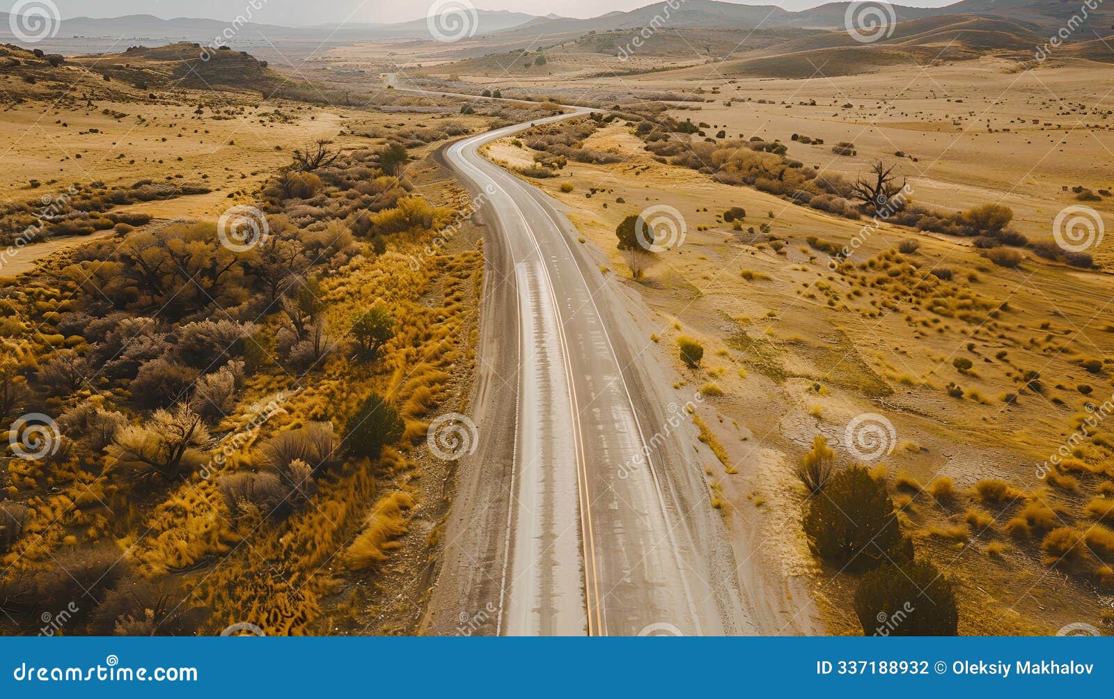 Aerial View of an Empty Road Passing through Remote Desert Landscape ...