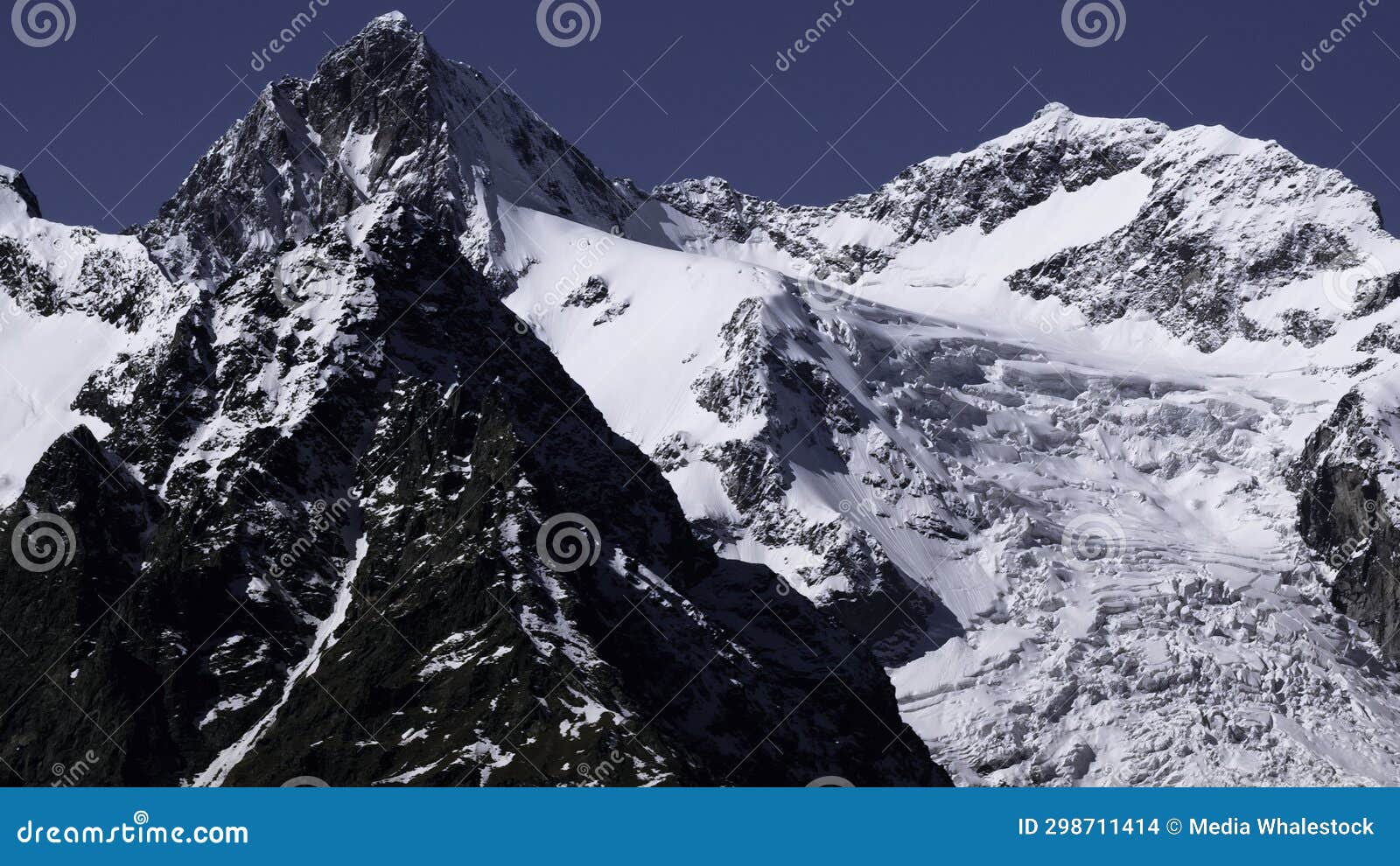 Aerial View of Epic Winter Snow Covered Mountains on a Blue Background ...