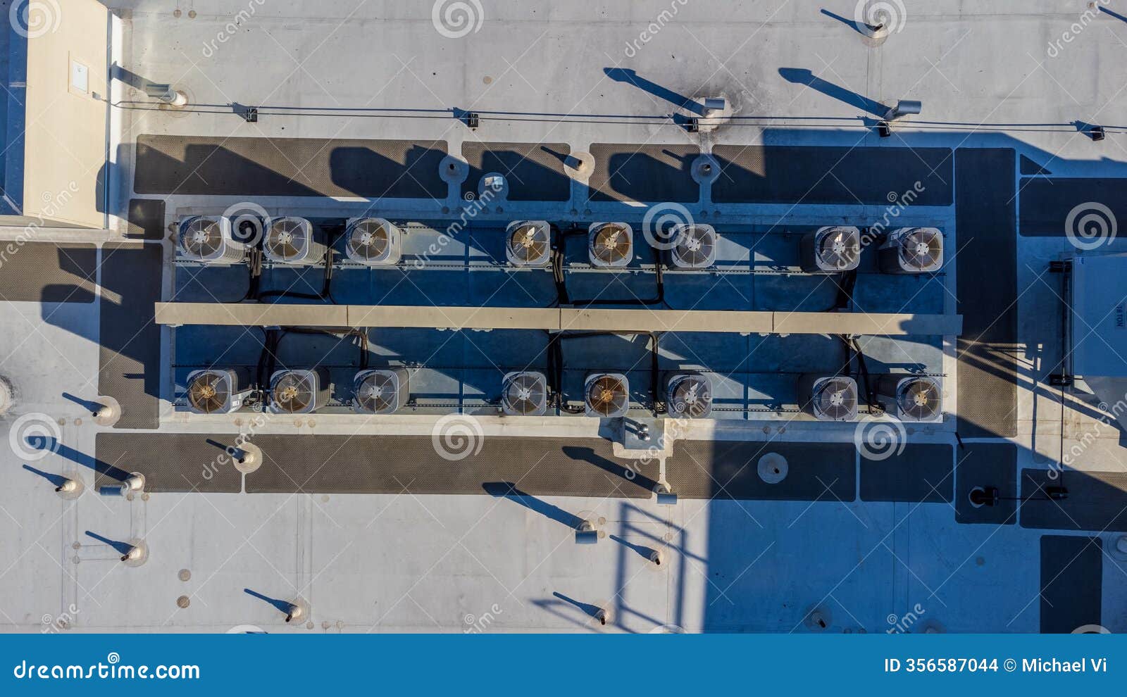 Aerial View of a Flat Rooftop with Air Conditioning Systems, Pipes, and ...