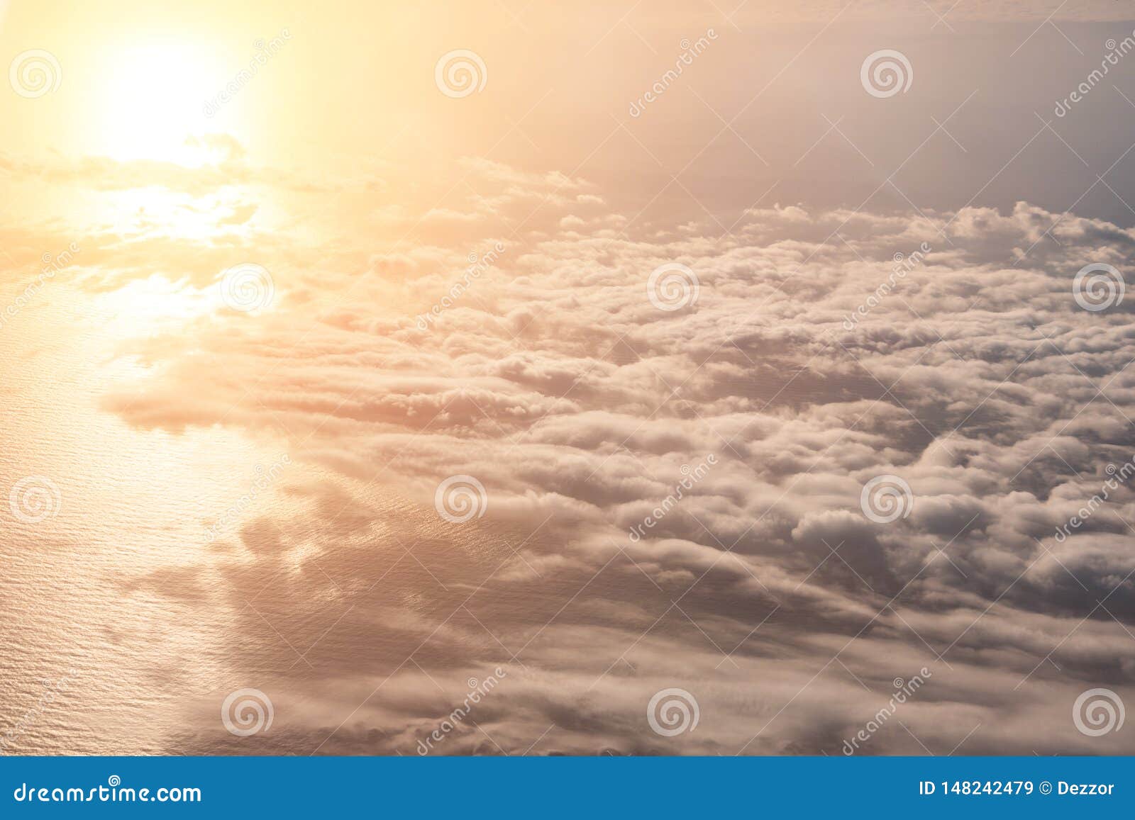 Aerial View from the Height of the Flight Above the Clouds, the Sun is ...