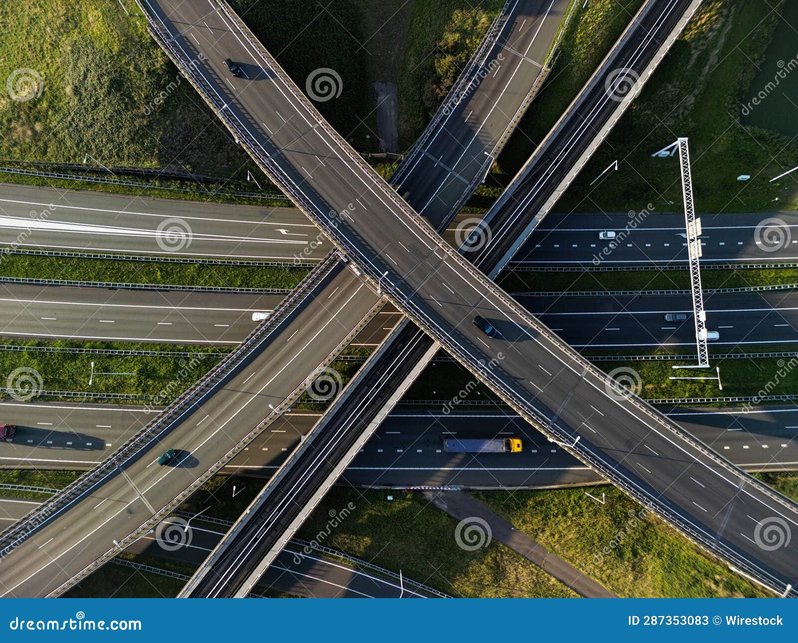 Aerial View of a Highway with Numerous Roads and Vehicles Navigating ...