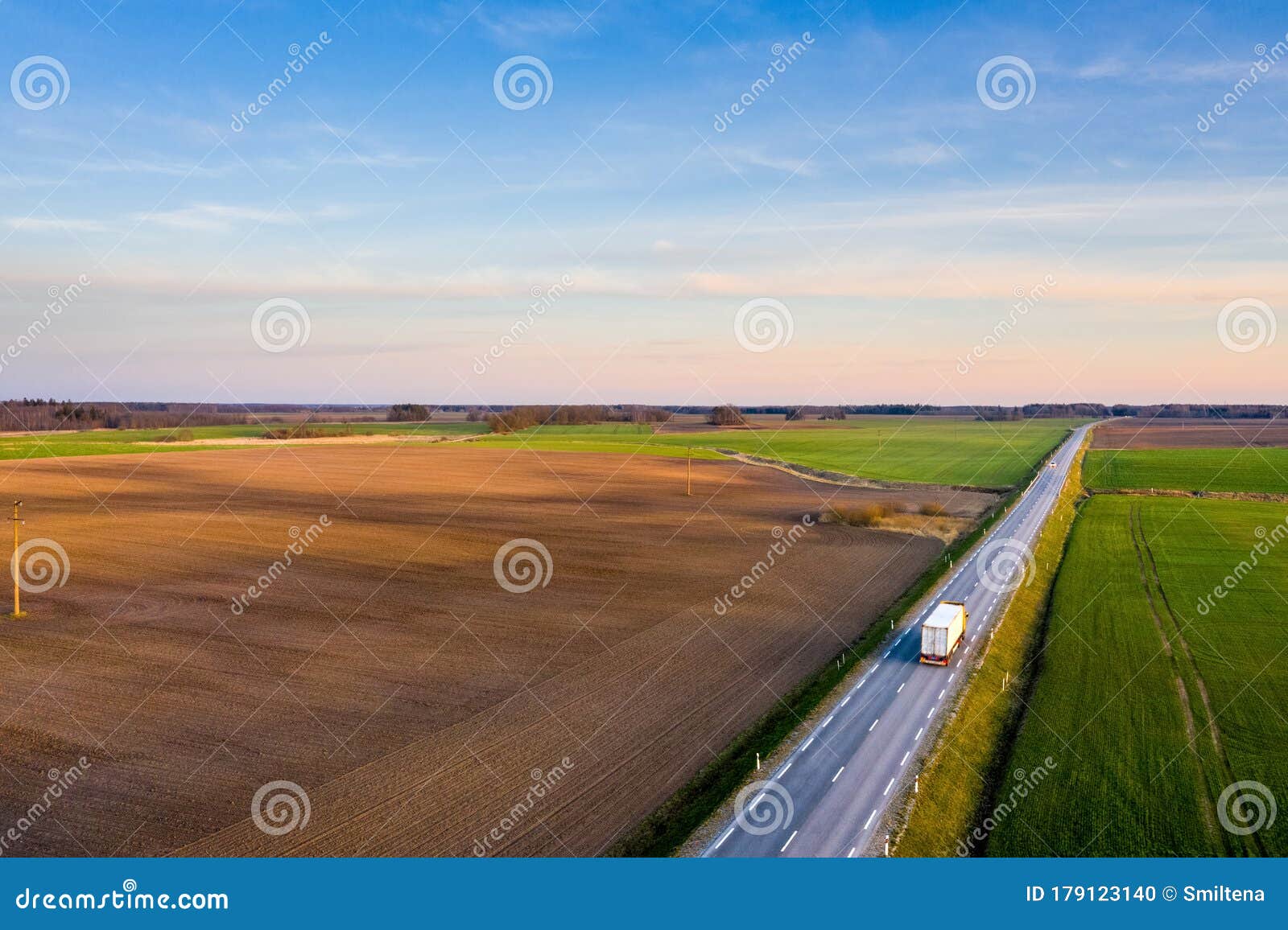 Aerial View of a Highway Passing through Spring Agricultural Fields ...