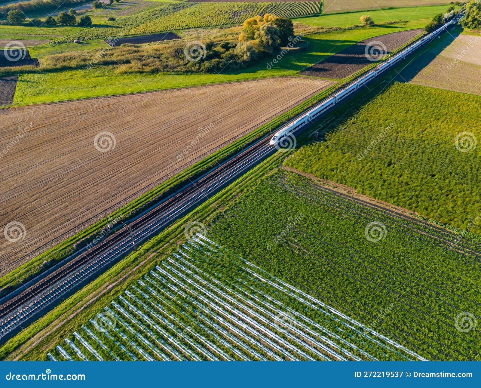 Aerial View of an ICE Express Train between Fields in the Countryside ...