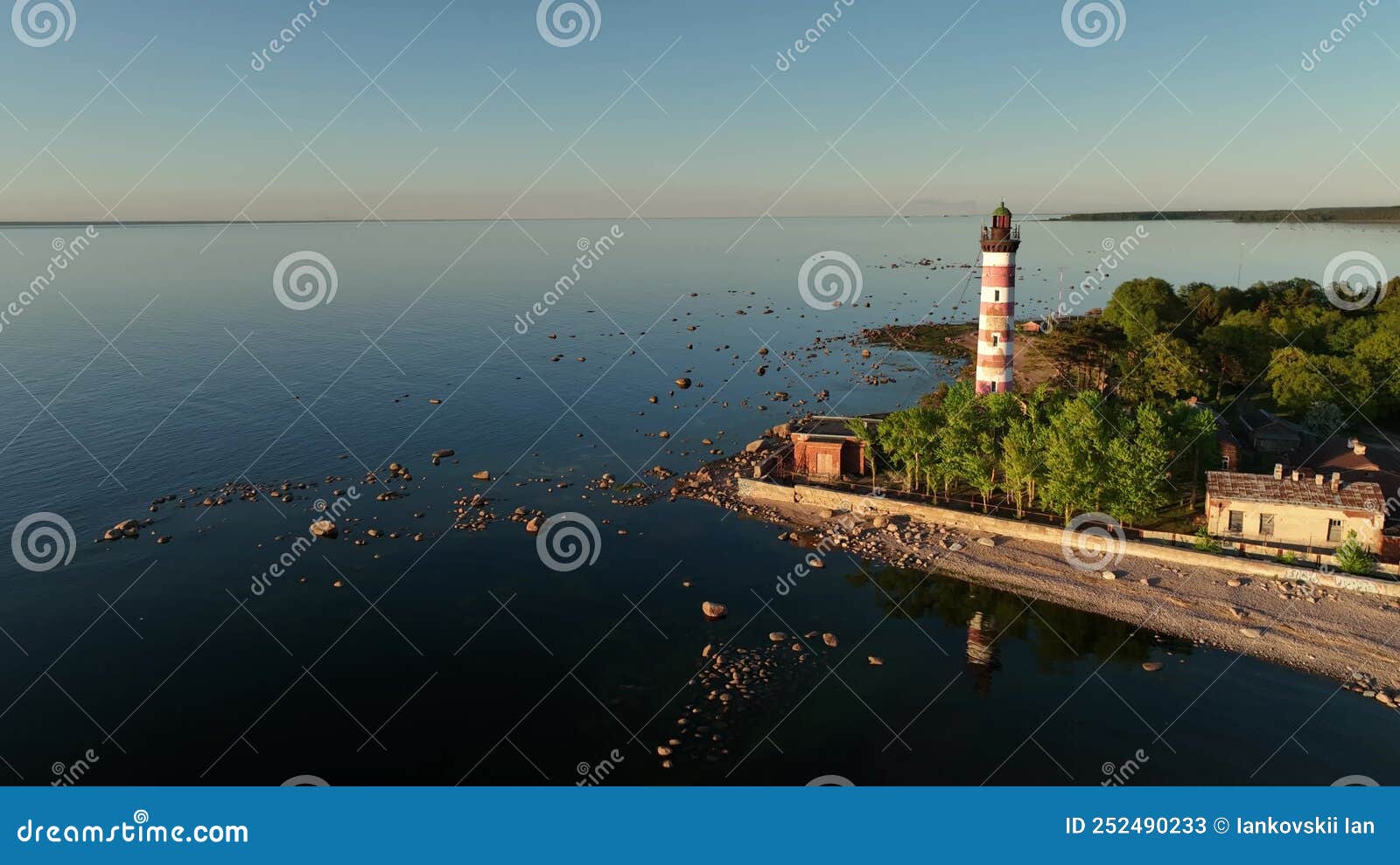 Aerial View of the Lighthouse at Sunset. Drone View of the Sea ...