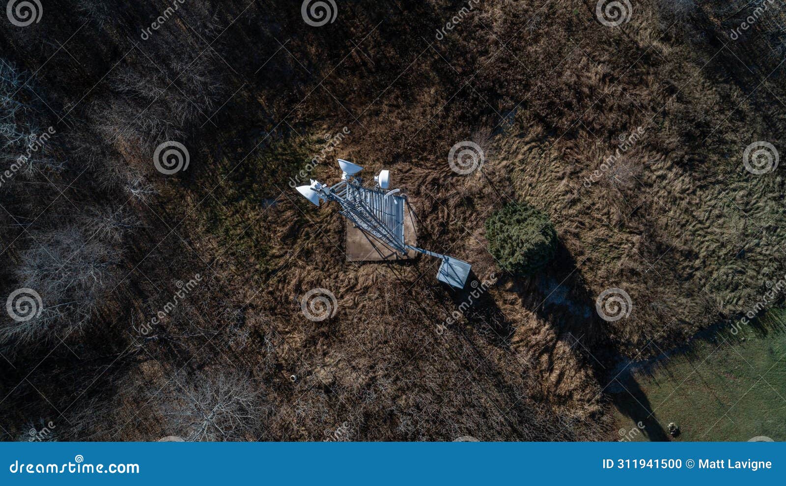 Aerial View Looking Down at a Communication Tower with Satellite Dishes ...