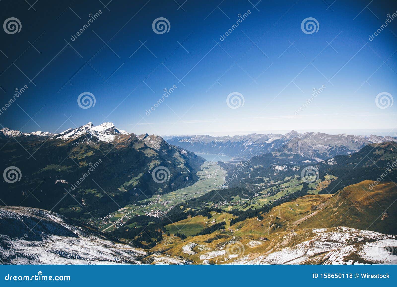 Aerial View of the Mountain Ranges Covered in Snow Under the Beautiful ...