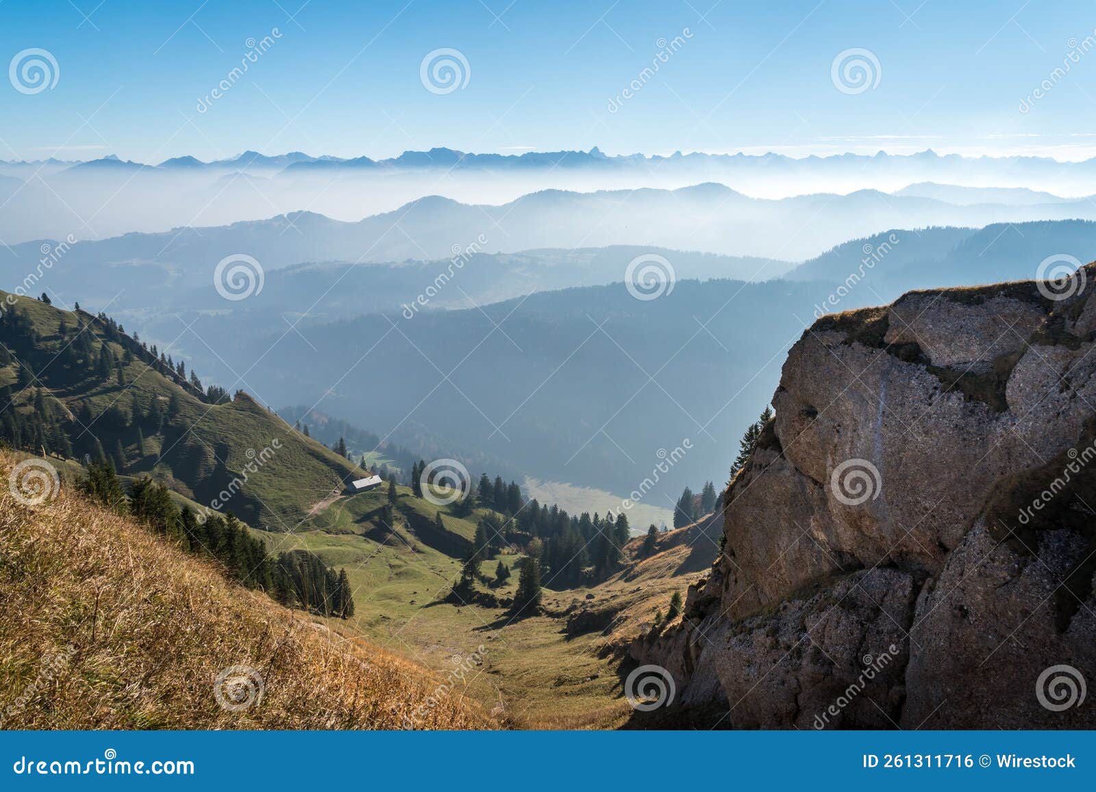 Aerial View of a Mountain Slope in Sunlight with a Range of High ...