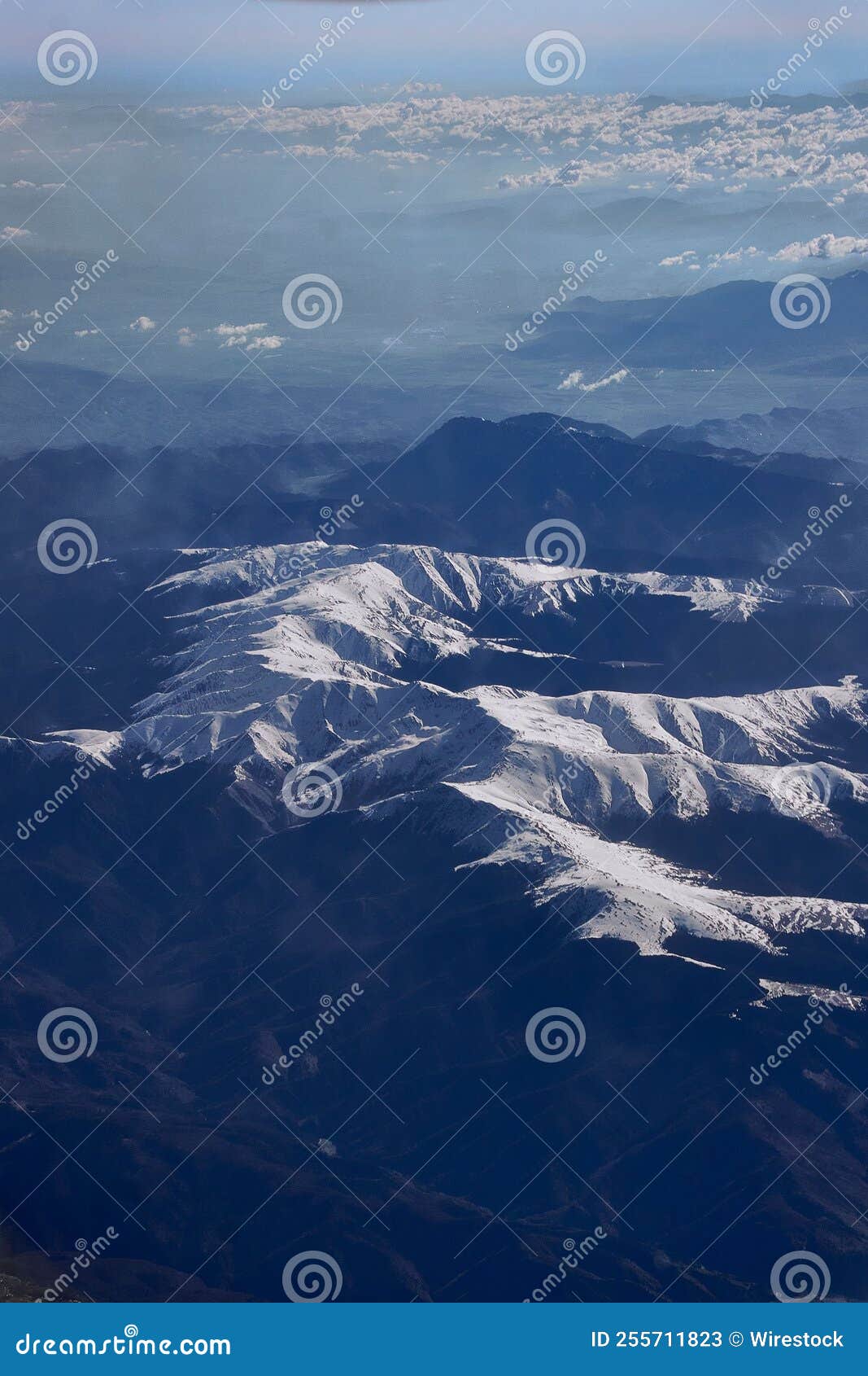 Aerial View of a Mountain with Snow on Top Stock Image - Image of plane ...
