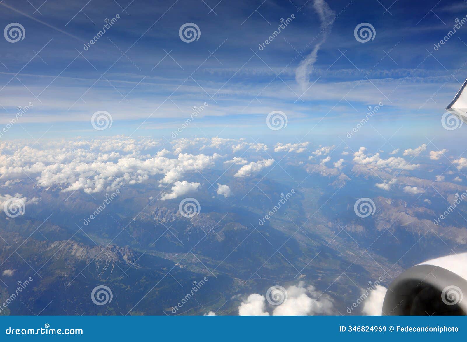 Aerial View of Mountains and White Clouds with the Airplane Engine and ...