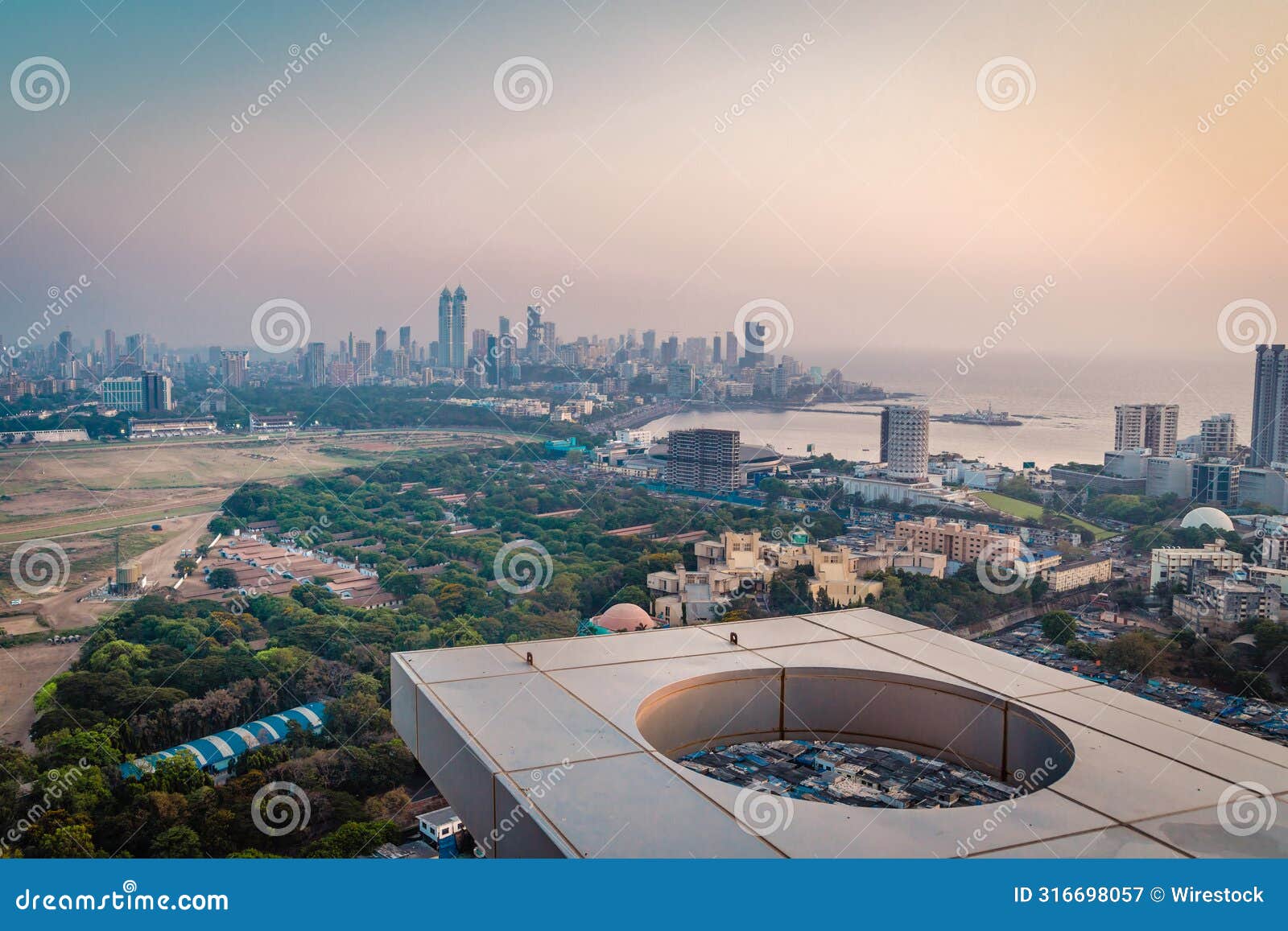 Aerial View of the Mumbai City Skyline at Sunset with Glowing Light ... Aerial View of the Mumbai City Skyline at Sunset with Glowing Light ...