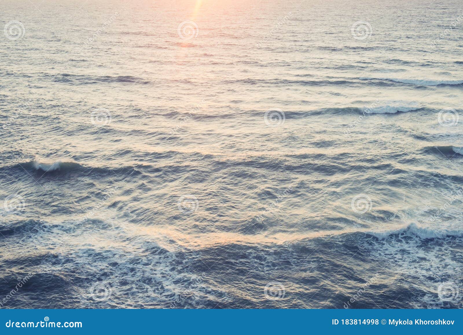 Aerial View Over the Ocean and Sun Rising Over Water Waves Surface ...