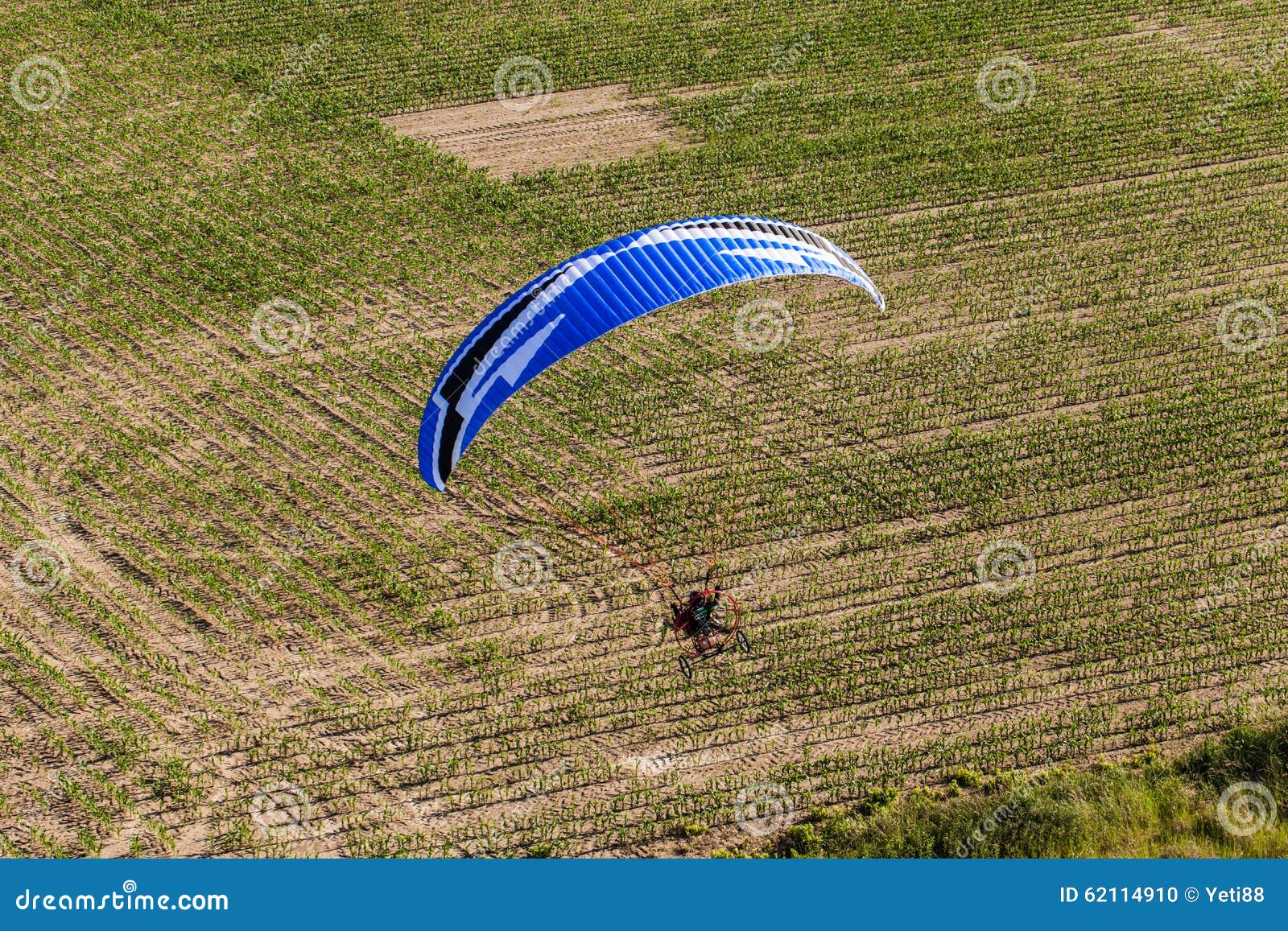 Aerial View of Paramotor Flying Over the Fields Stock Photo - Image of ...
