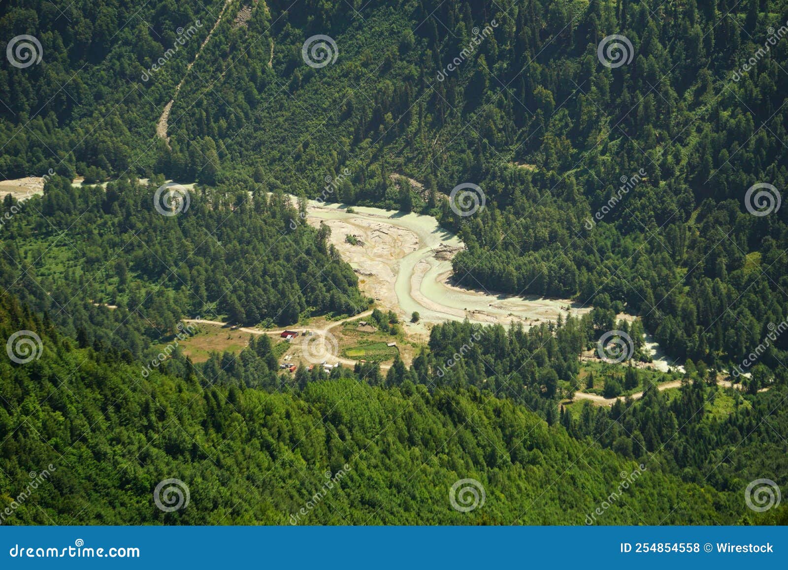 Aerial View of a Path through Forested Mountains Stock Photo - Image of ...