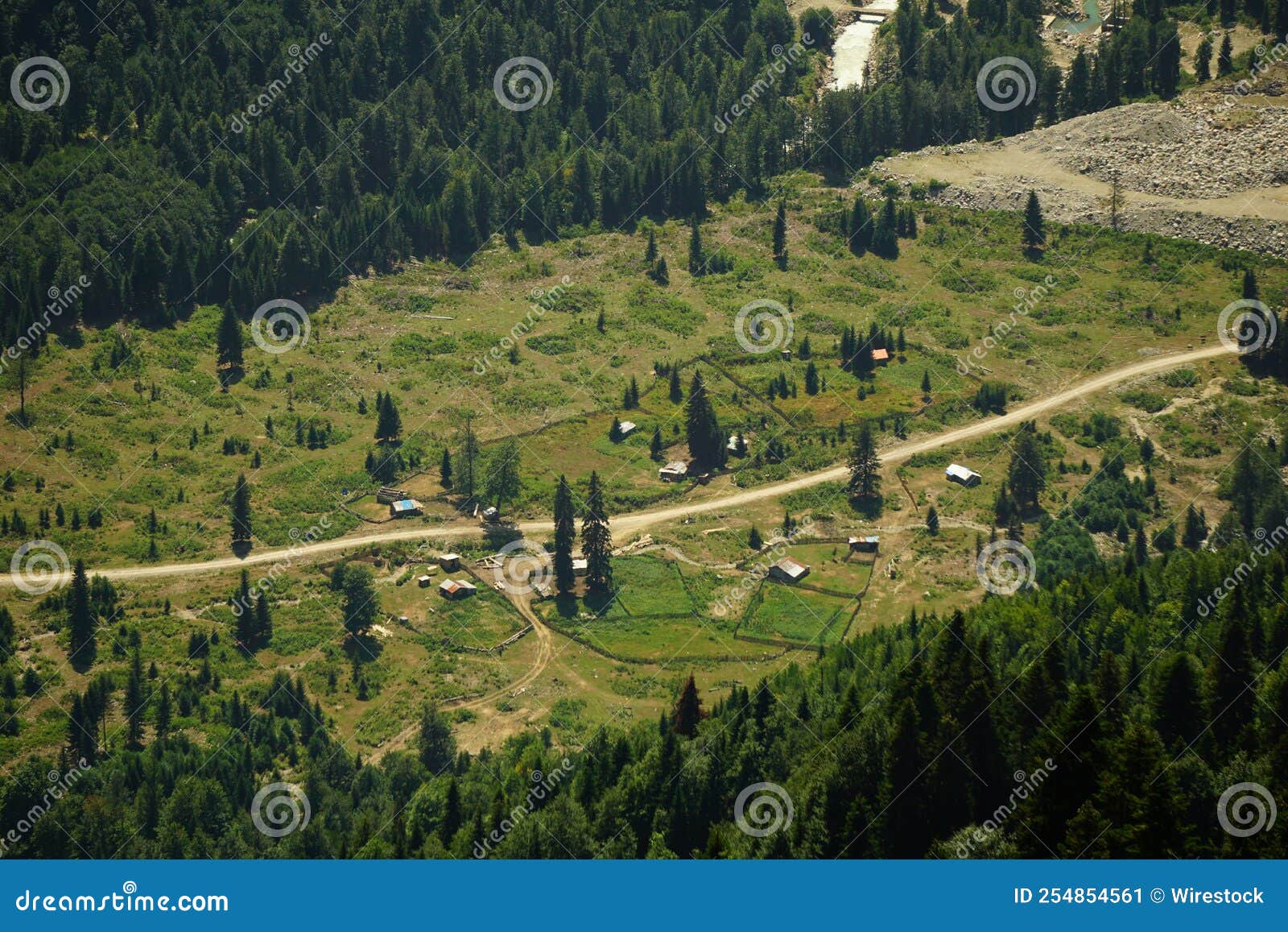 Aerial View of a Path through Forested Mountains Stock Image - Image of ...