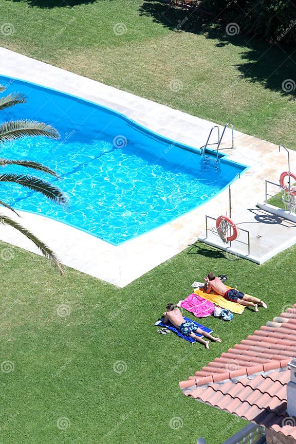 Aerial View of People Sunbathing by a Pool Stock Photo - Image of ...