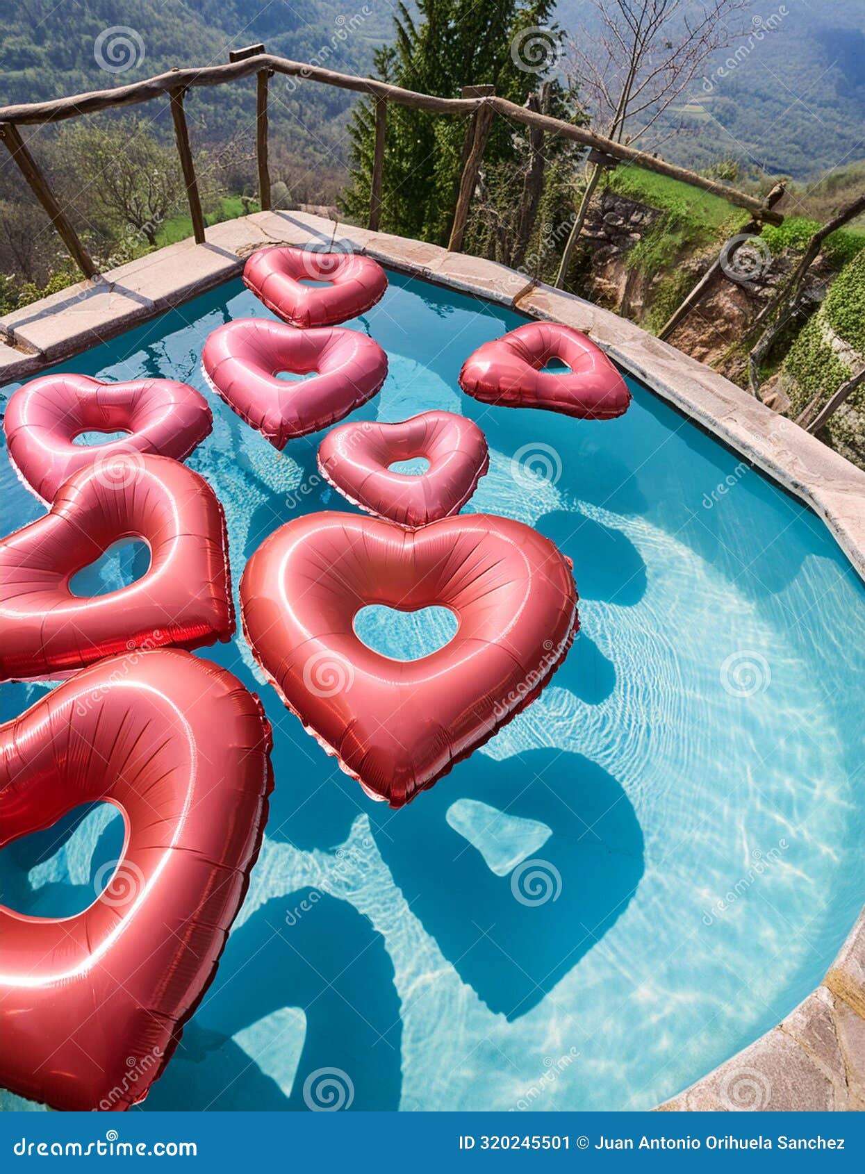 An Aerial View of a Pool Dotted with Heart-shaped Floats Stock ...