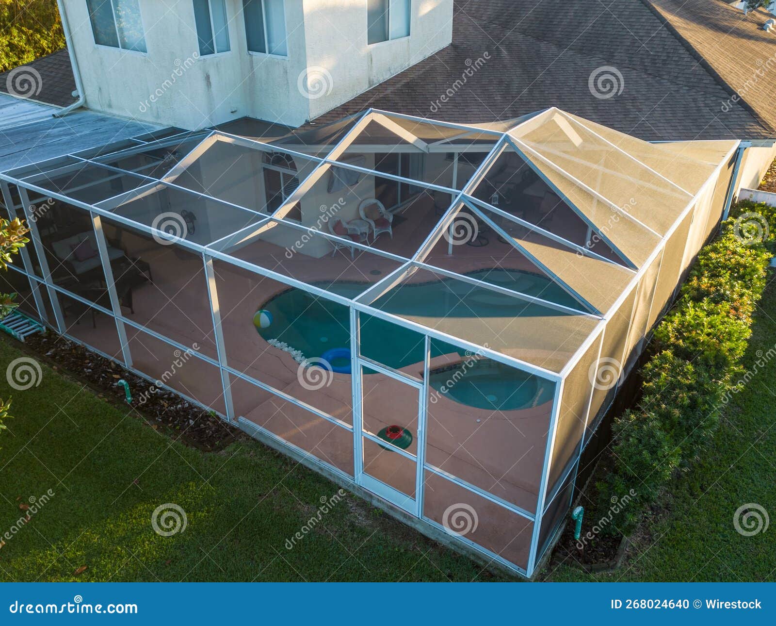 Aerial View of Pool Screen Enclosure Surrounded by Trees Stock Photo ...
