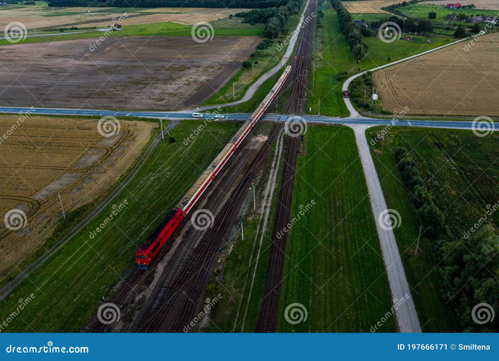 Aerial View of the Railway with a Running Passenger Train and a Railway ...