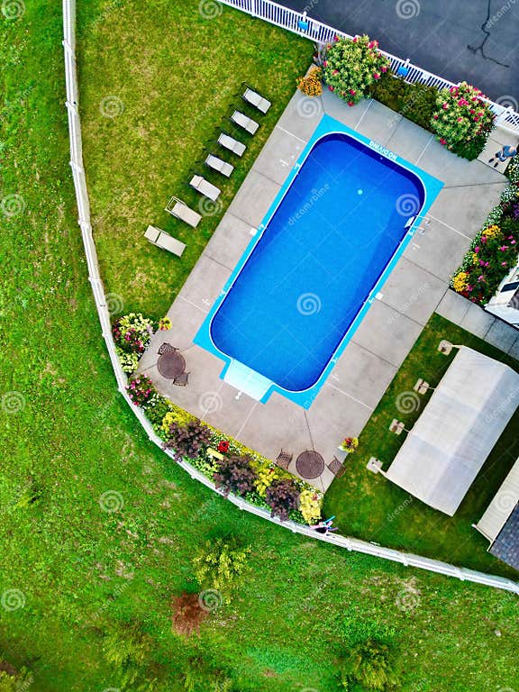 Aerial View of a Residential Backyard with a Large Rectangular Swimming ...