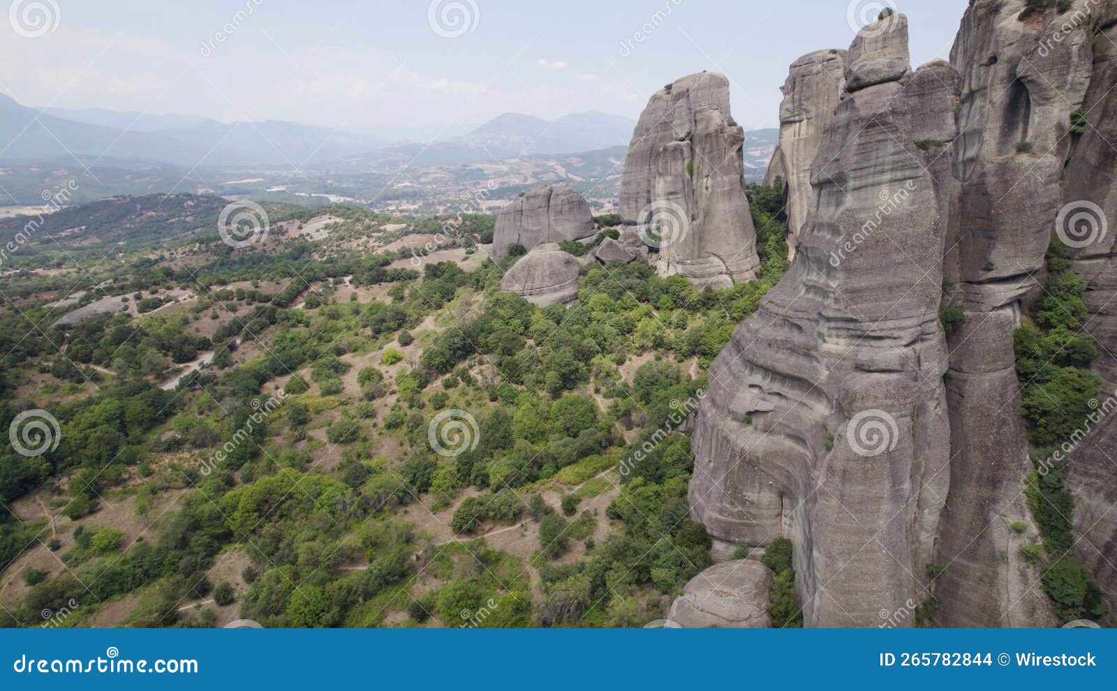 Aerial View of Rock Formations Surrounded by Dense Trees in Meteora ...