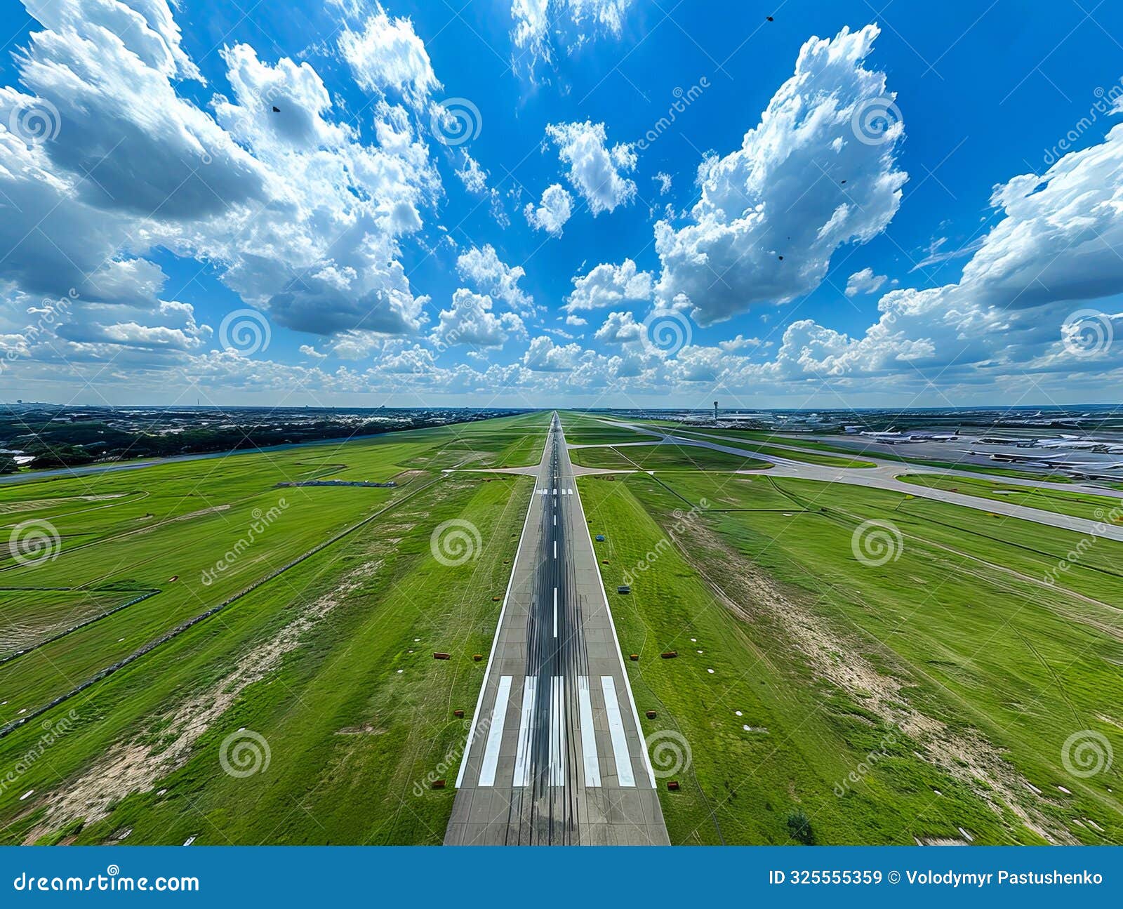An Aerial View of a Runway with Clouds in the Sky Stock Image - Image ...