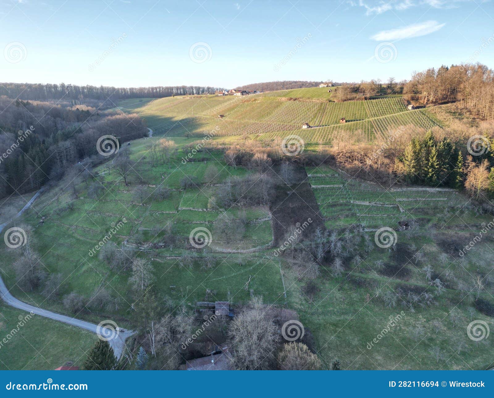 Aerial View of an Rural Farm with a Winding Path To the Fields and a ...