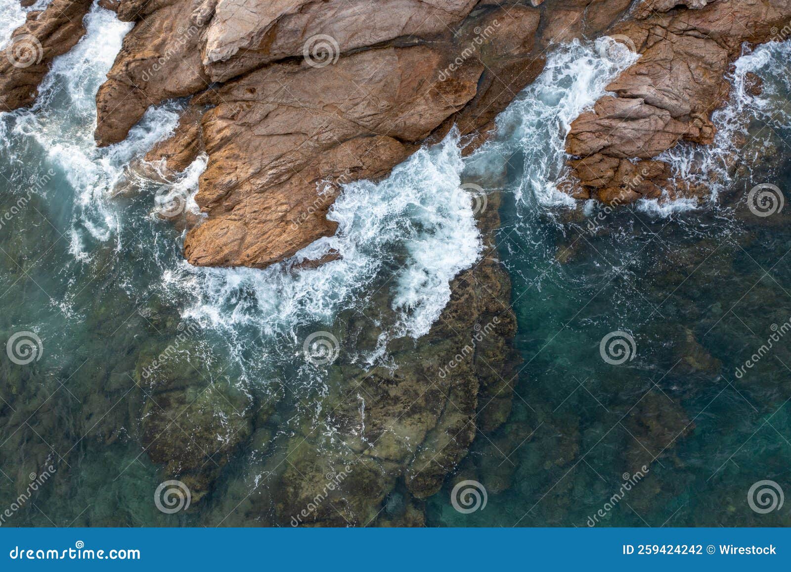 Aerial View of a Sea Stack Splashed with Foamy Sea Waves Stock Photo ...